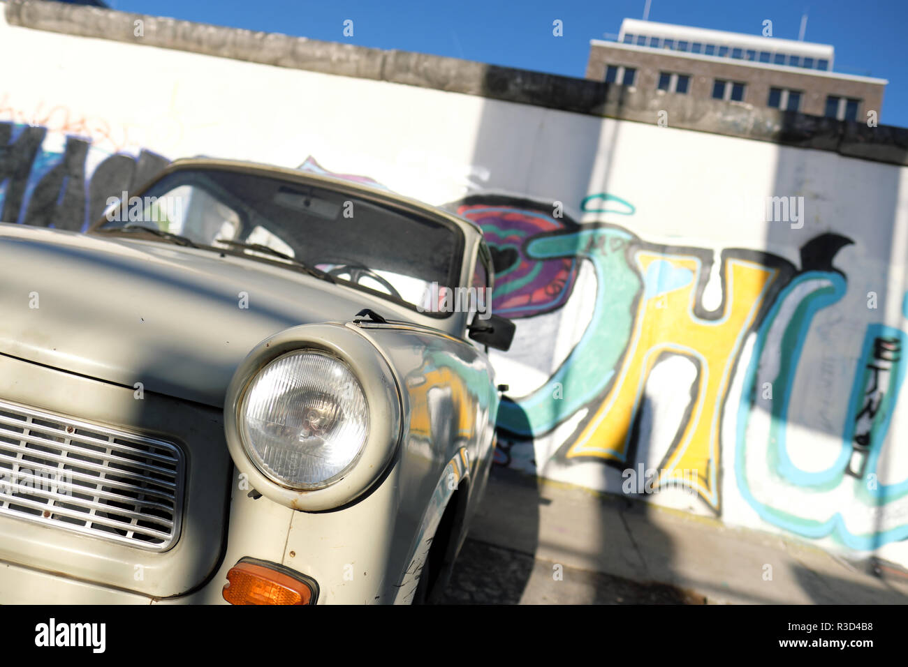 Berlin Germany - Trabant car parked alongside the Berlin Wall at the ...