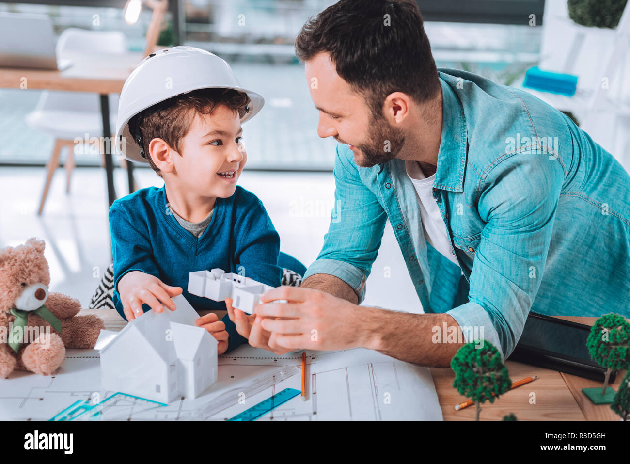 Example to follow. Inspired small kid starring at the man while sitting ...