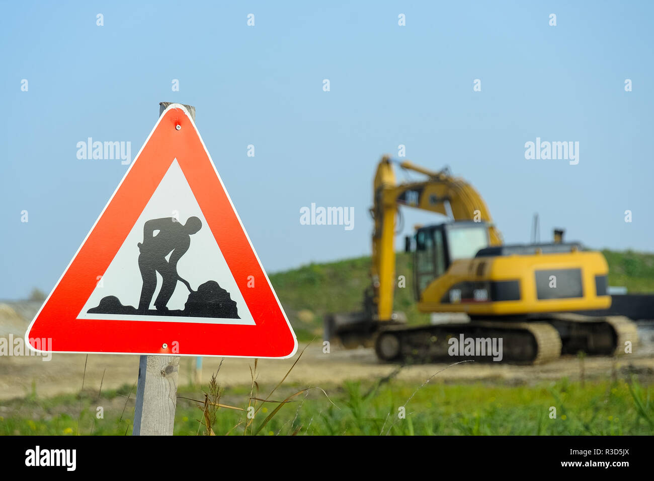 traffic signs construction site with excavator Stock Photo - Alamy