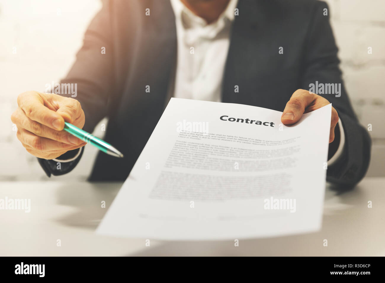partnership - businessman giving business contract to sign Stock Photo ...