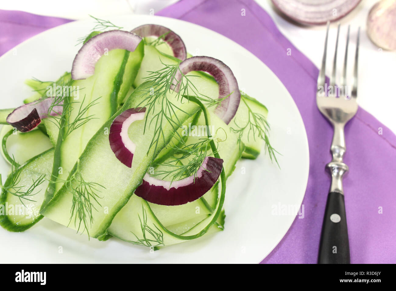 cucumber salad with red onions and dill Stock Photo - Alamy