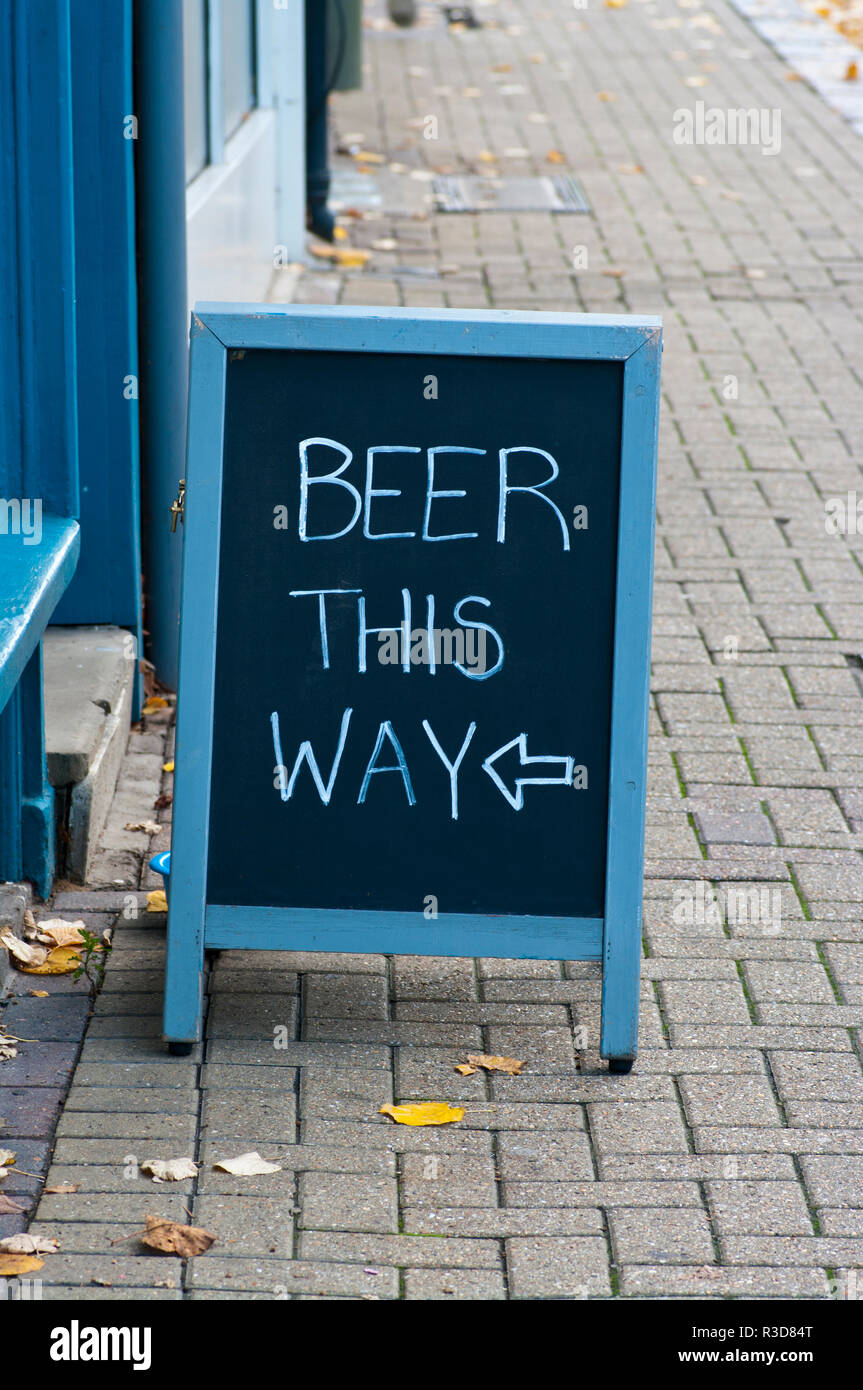 Beer This Way Sign Stock Photo - Alamy