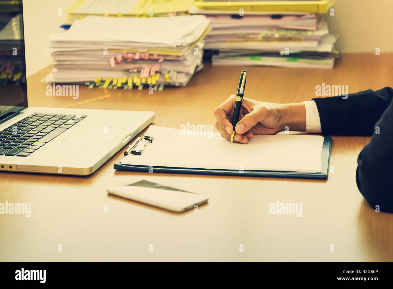 Business sucessful hand signing contract form on wooden desk in office ...