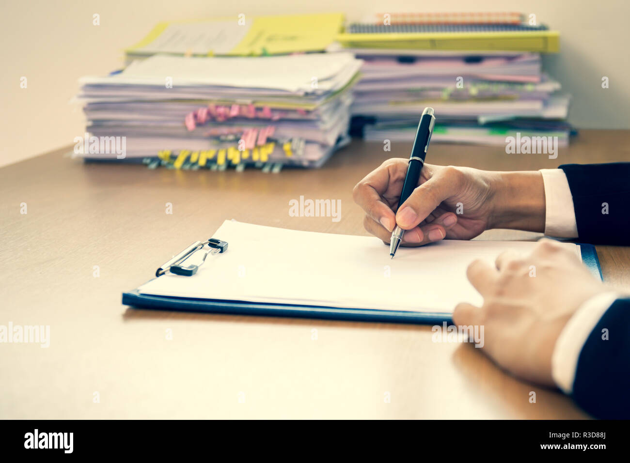 Business sucessful hand signing contract form on wooden desk in office ...