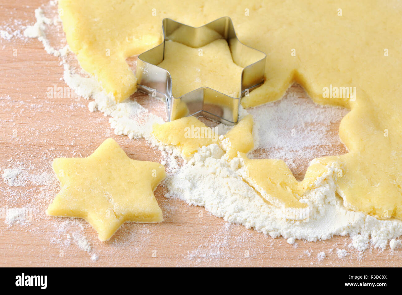 baking christmas star shape cookies. fresh dough Stock Photo - Alamy