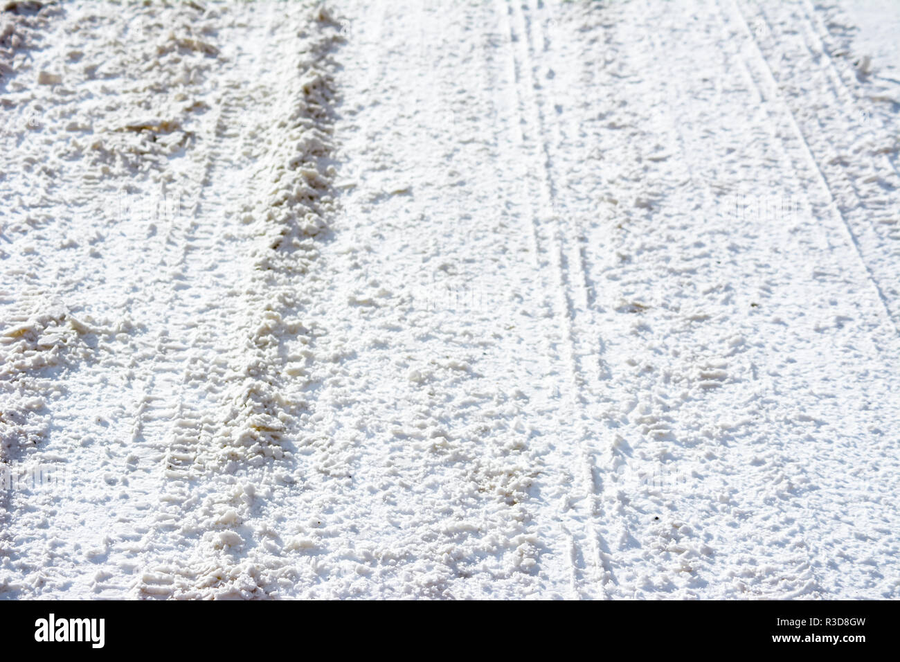 Country road in winter, snow and track of tyres Stock Photo - Alamy