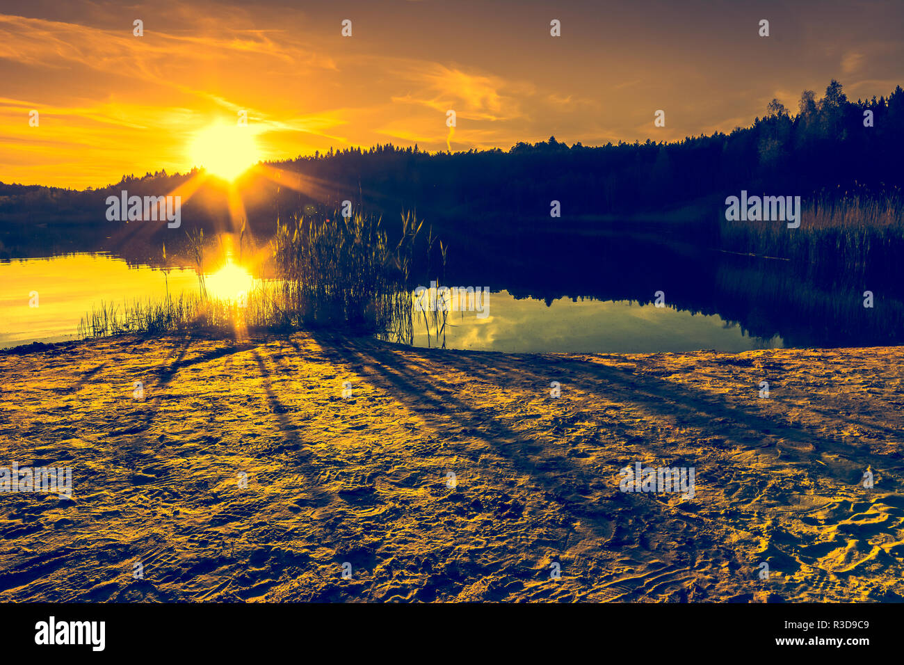 Nature landscape with sunset sky and sun reflection in the water of ...