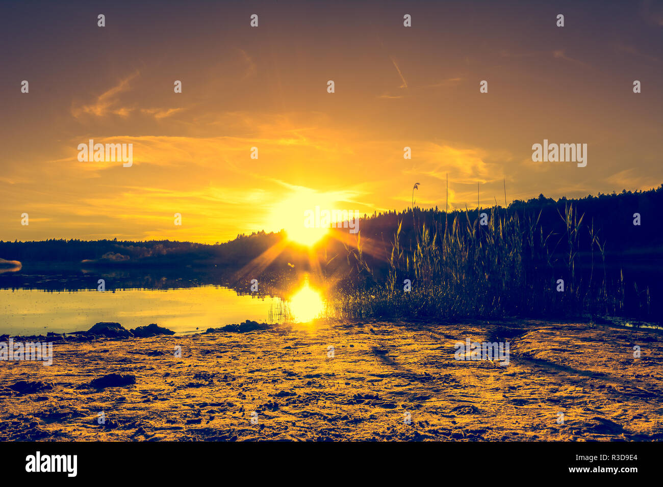 Nature landscape with sunset sky and sun reflection in the water of ...