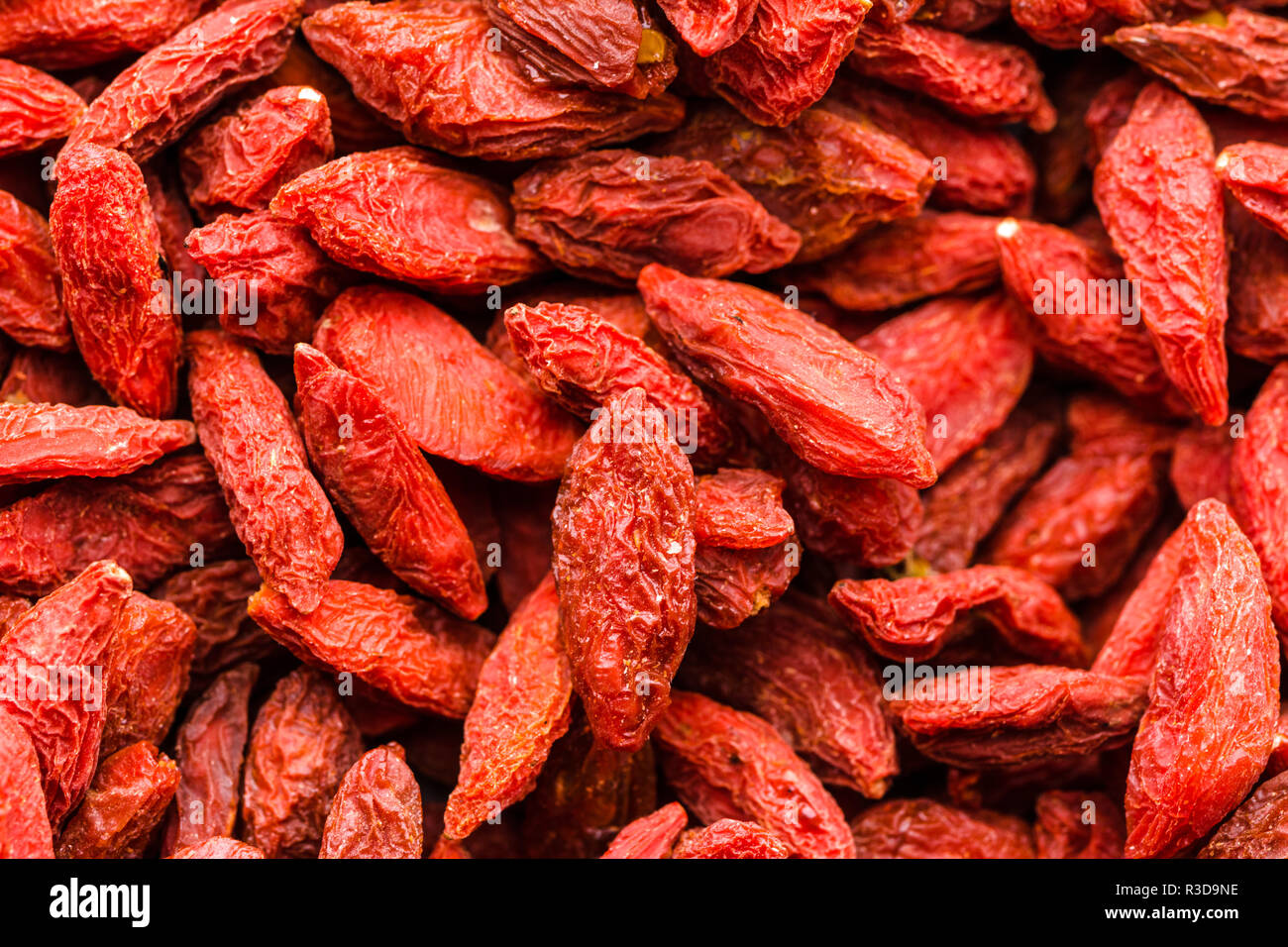 Red background of goji berry, texture and natural pattern of dried ...