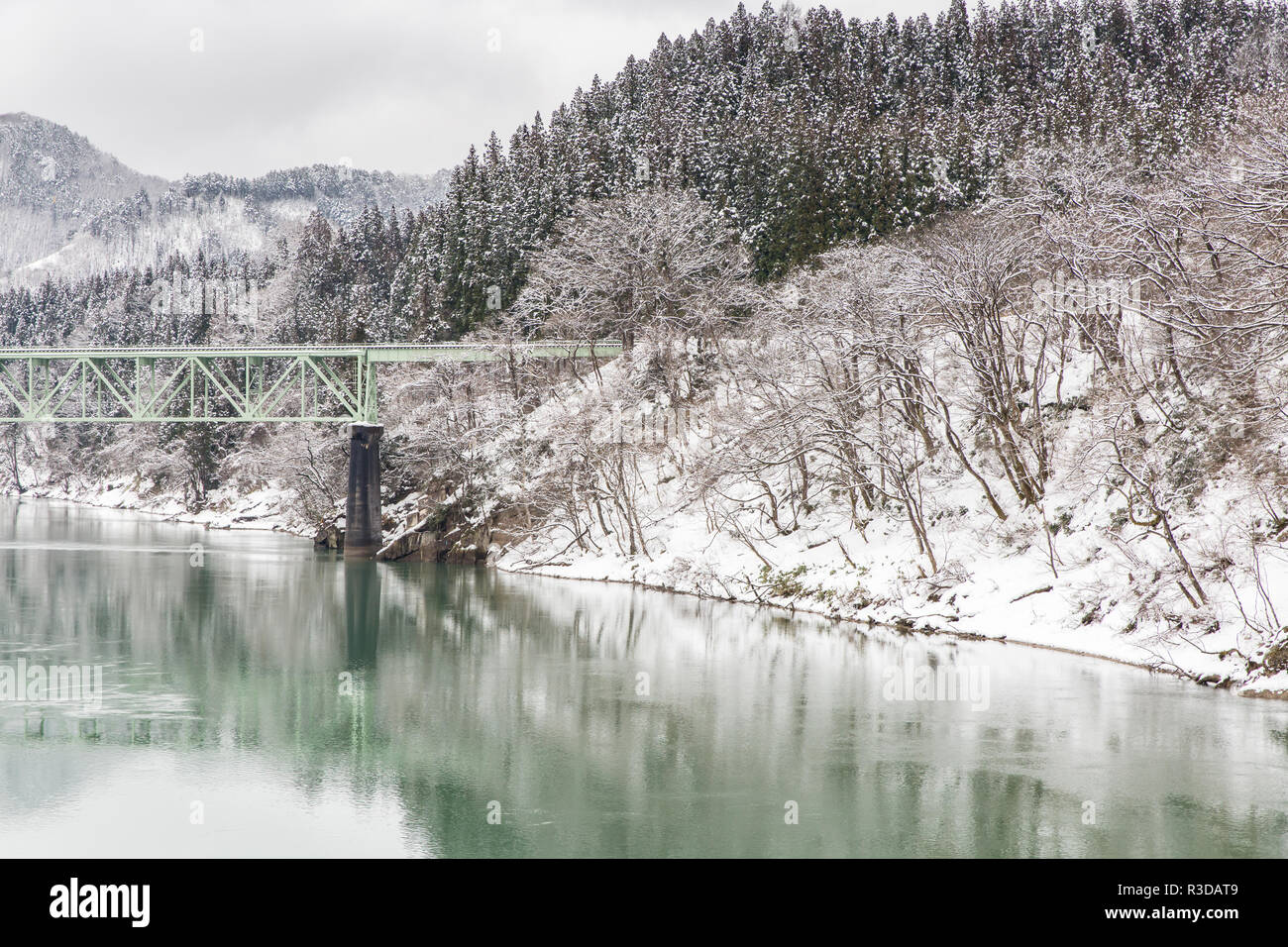Train in Winter landscape snow on bridge Stock Photo - Alamy