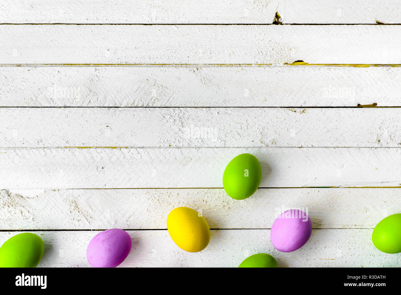 Spring easter eggs background, seasonal colored eggs on white wooden ...