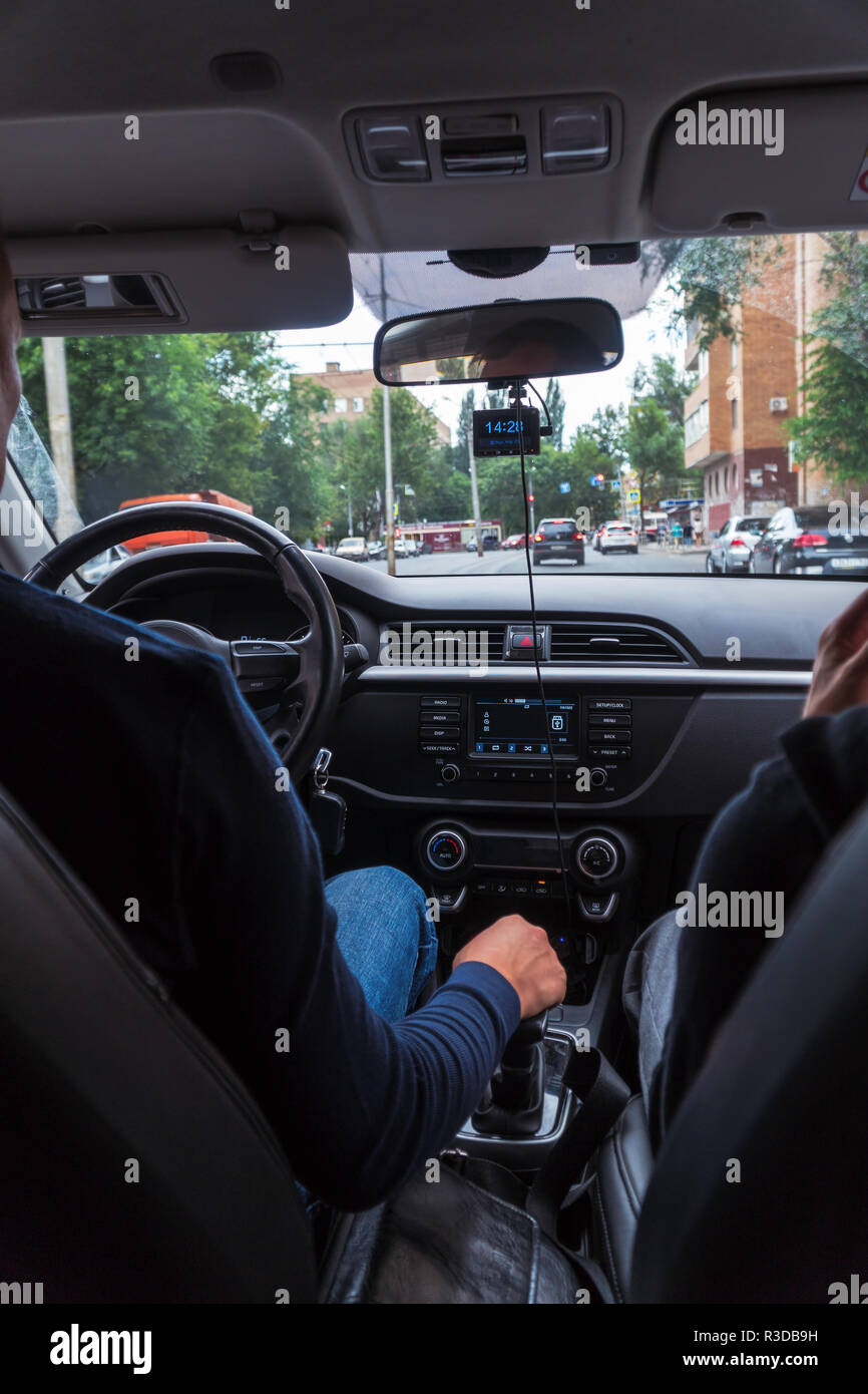 Man driving a car. View of the street from the windshield Stock Photo ...