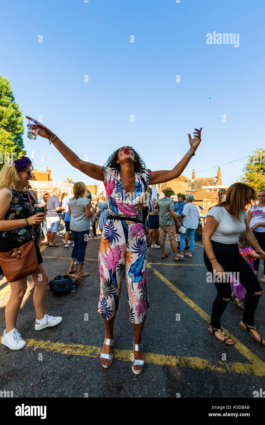 Faversham Hop Festival 2018. People, audience, at concert in car park ...