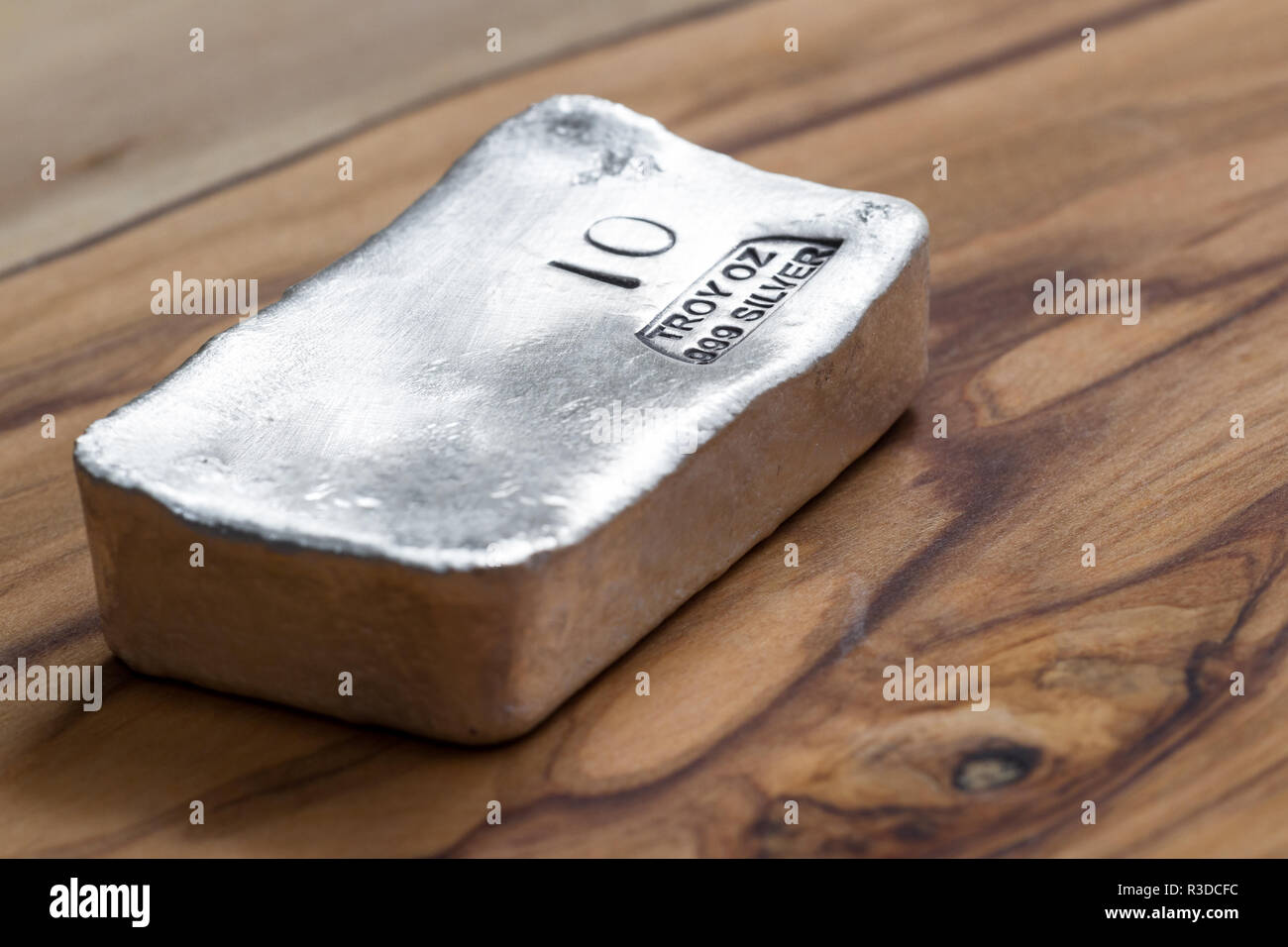 Close up of a 10 gram bar of poured silver as a precious metal holding ...