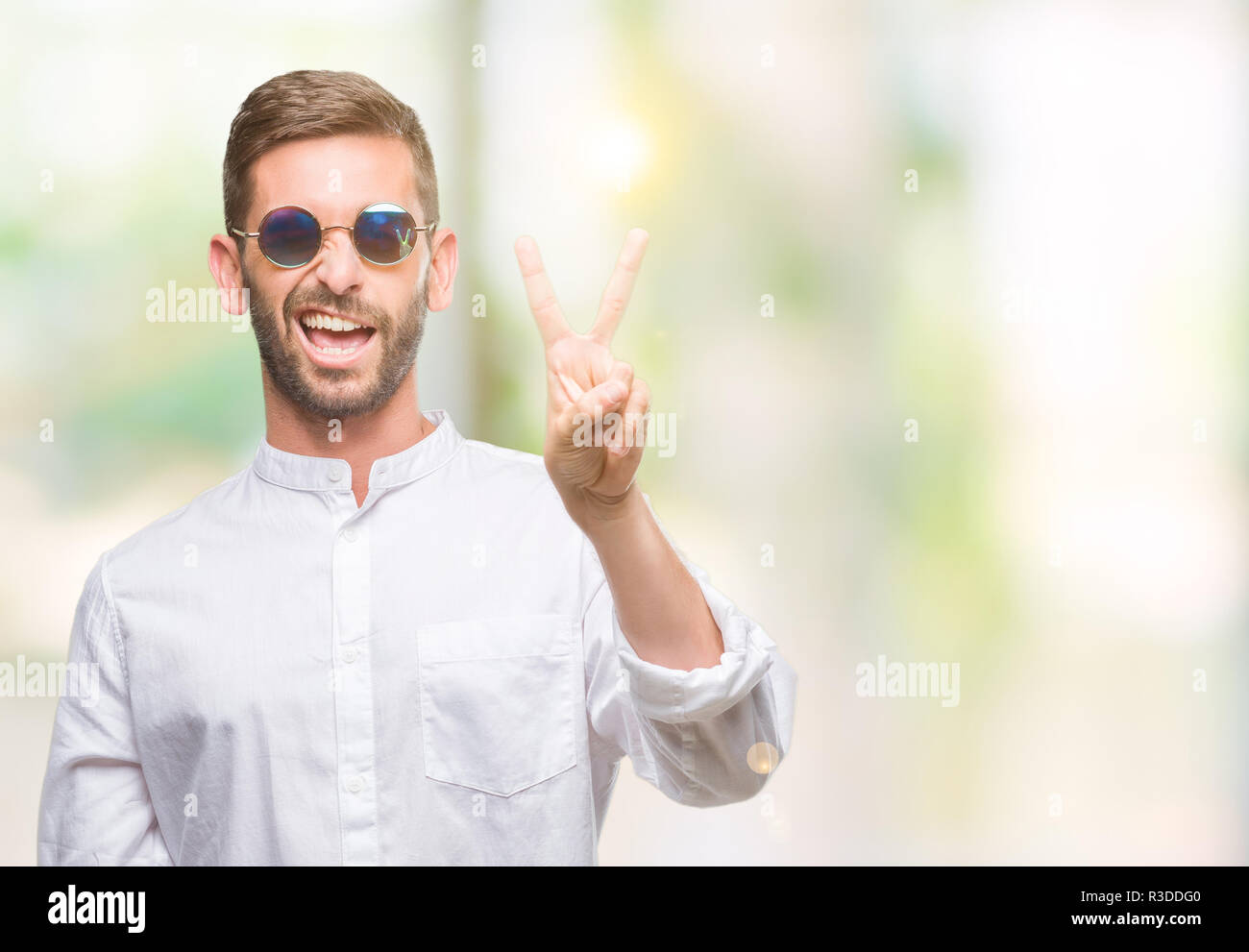 Young handsome man wearing glasses over isolated background smiling ...