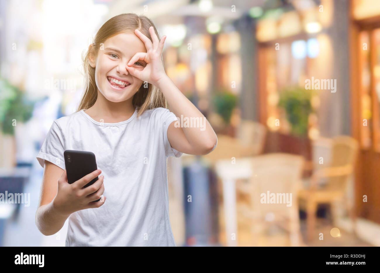 Young beautiful girl sending message texting using smarpthone over ...