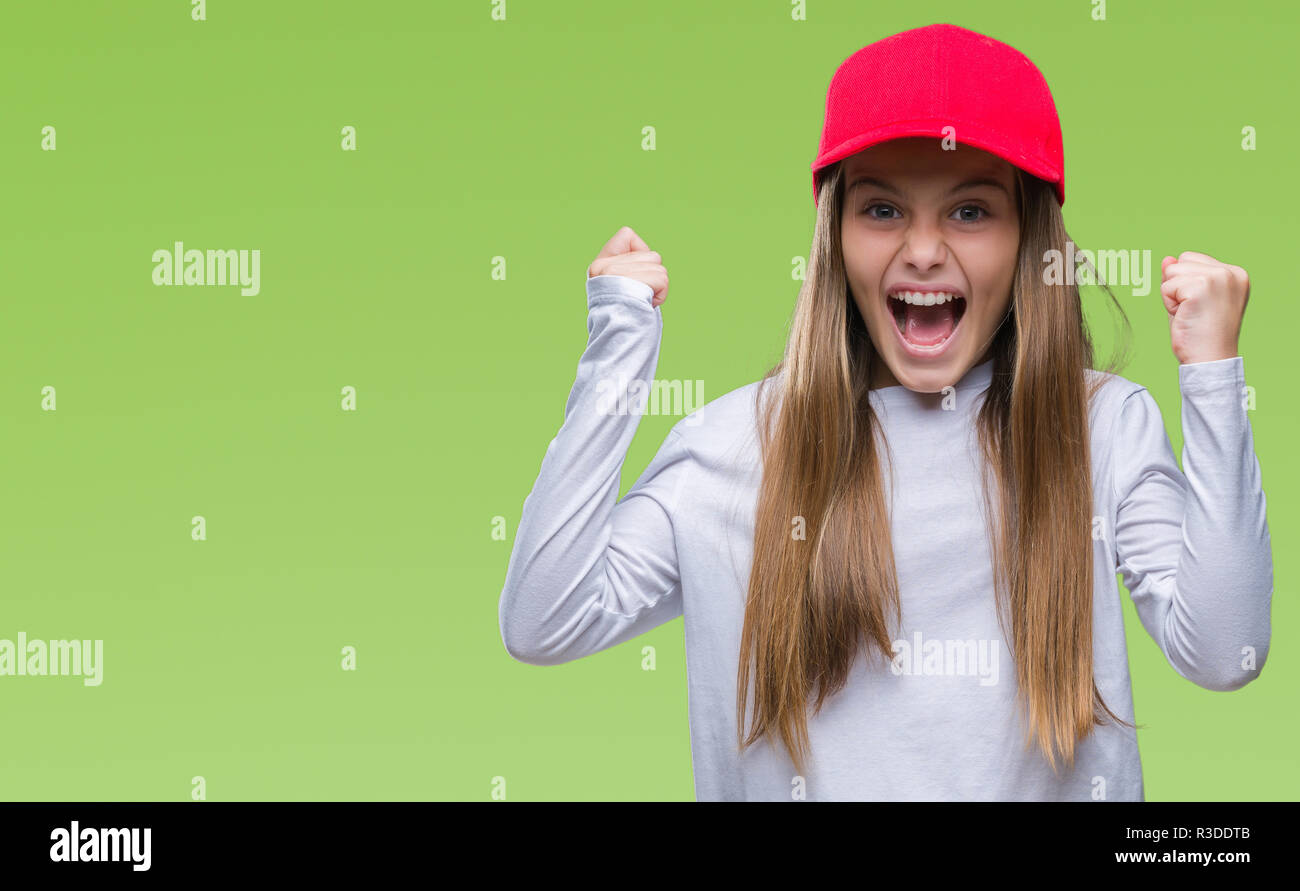 Young beautiful girl wearing red cap isolated background celebrating ...