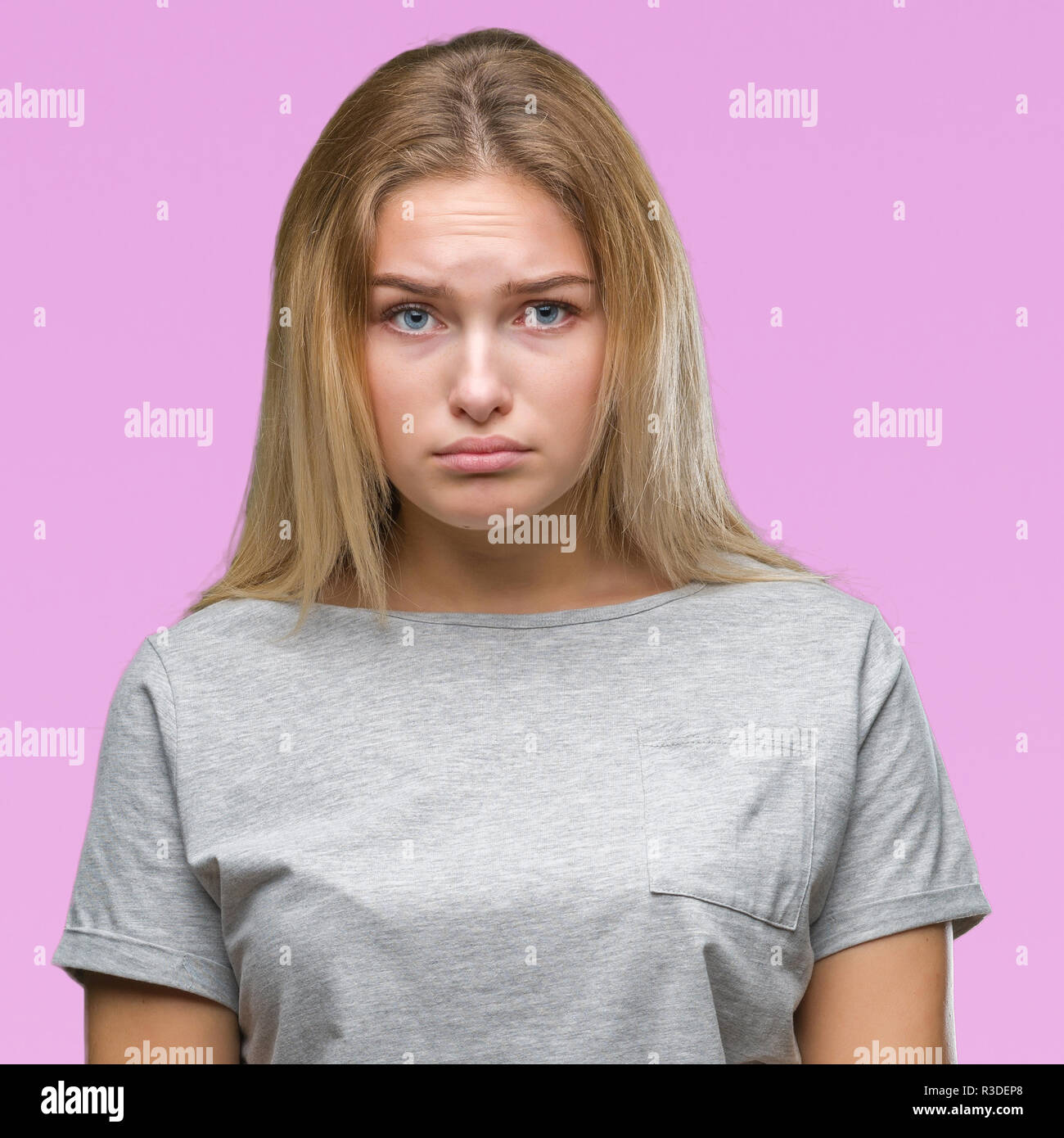 Young caucasian woman over isolated background depressed and worry for ...