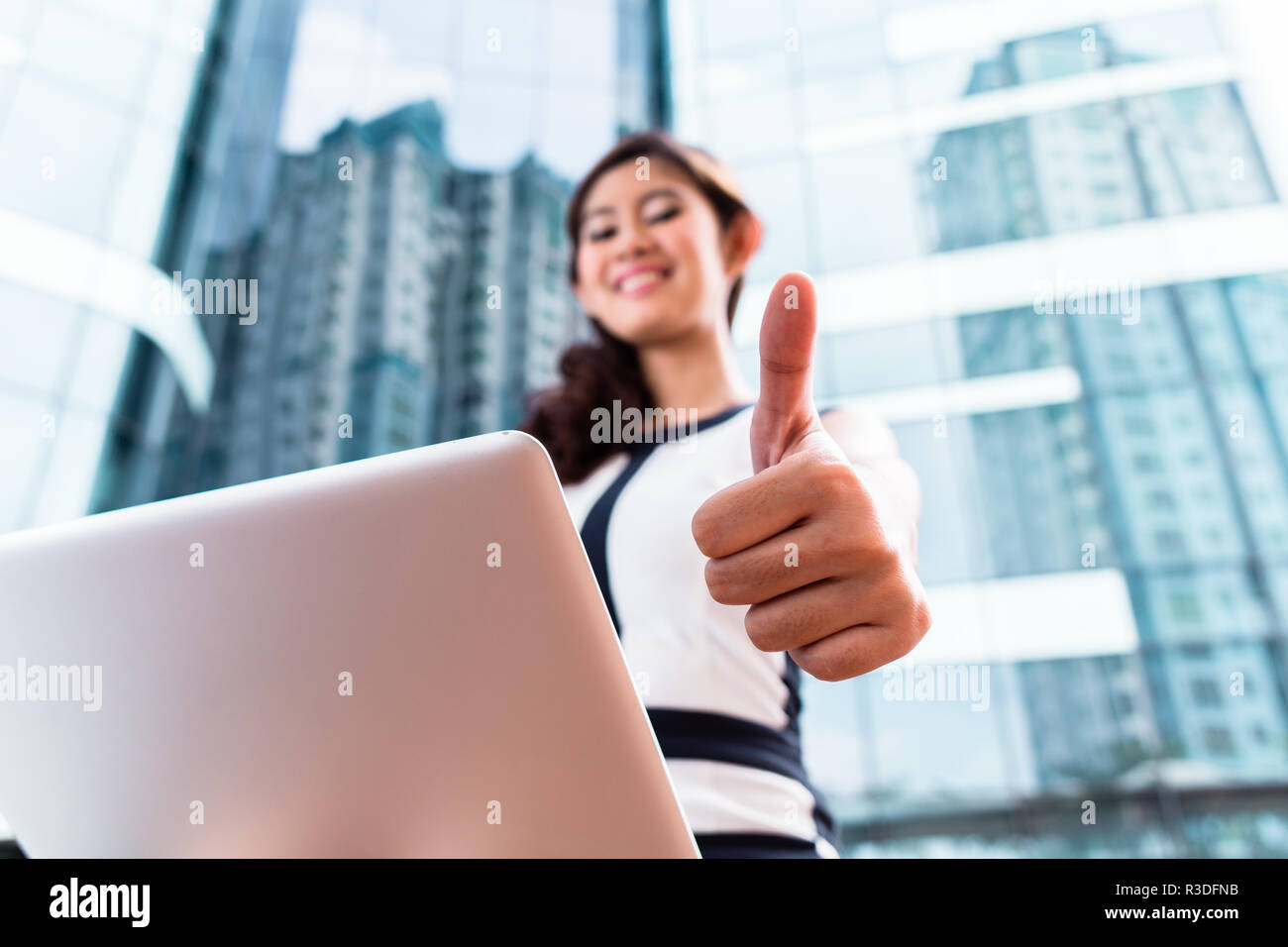 Young woman high rise building sitting window hi-res stock photography ...