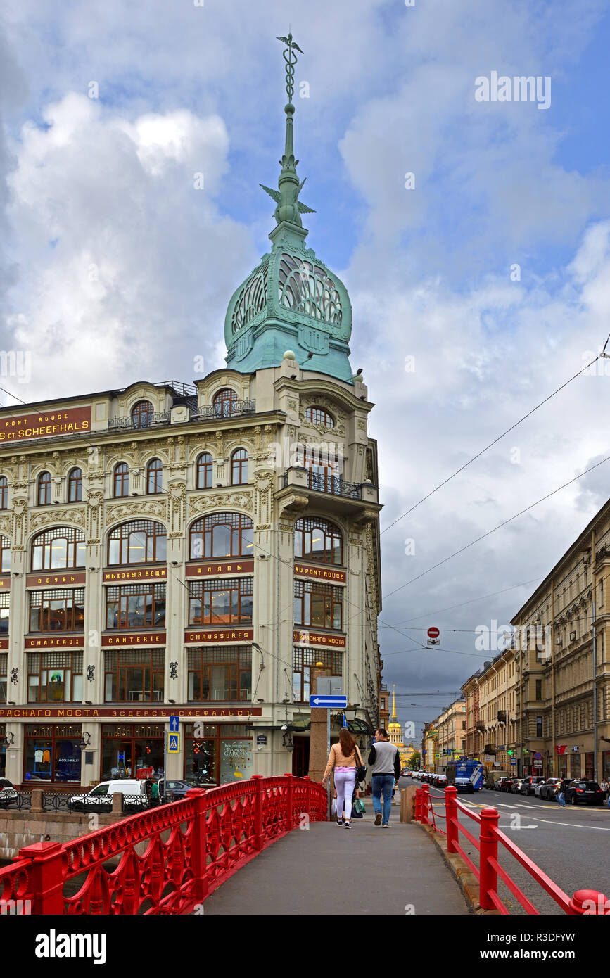 Red Bridge, single-span bridge across Moika River on background of ...