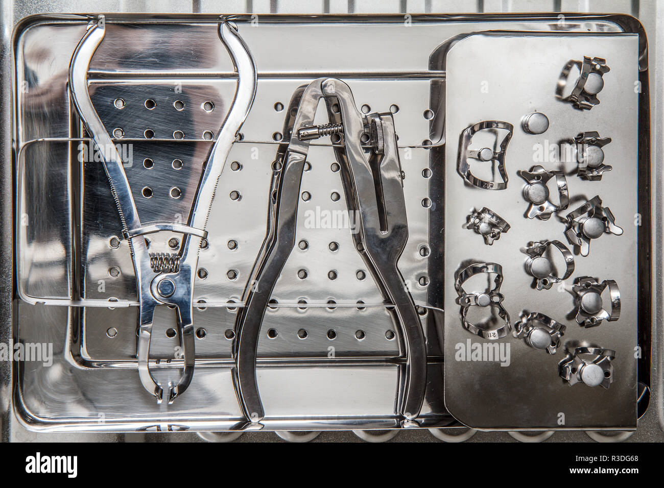 Dental instruments on stainless steel tray are prepared for the dental ...