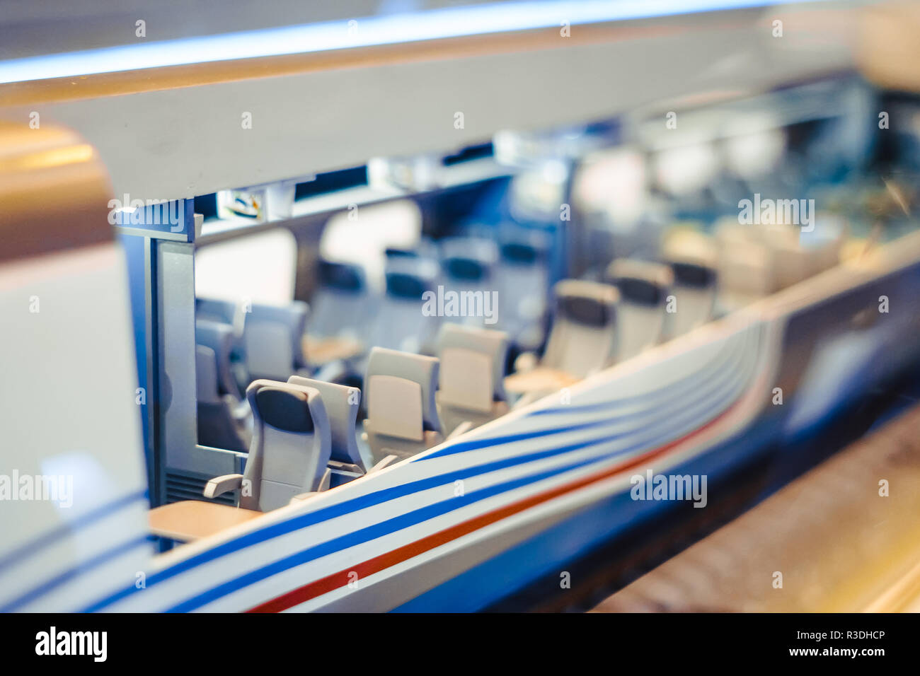 Miniature toy model of modern train crossing bridge Stock Photo - Alamy