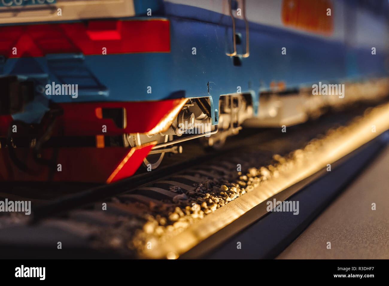 Miniature toy model of modern train crossing bridge Stock Photo - Alamy