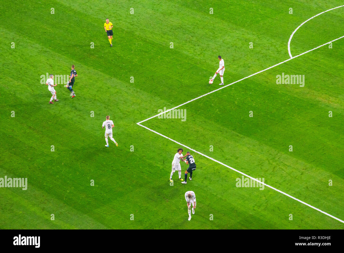 Footballers playing a football match. Santiago Bernabeu stadium, Madrid ...