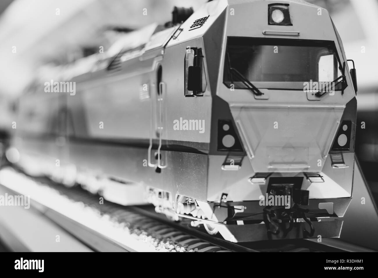 Miniature toy model of modern train crossing bridge Stock Photo - Alamy
