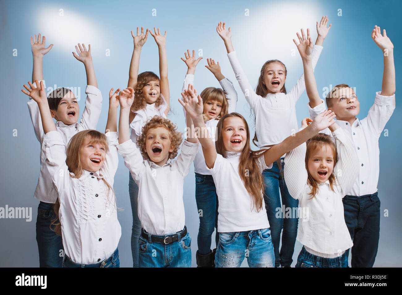 Adorable kids have fun together at birthday party. They playing ...