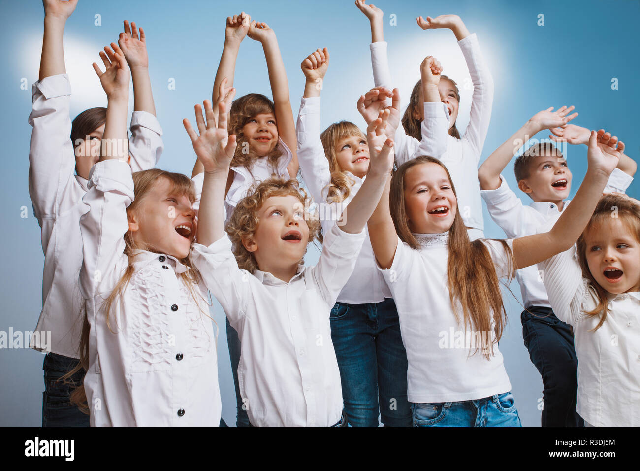 Adorable kids have fun together at birthday party. They playing ...