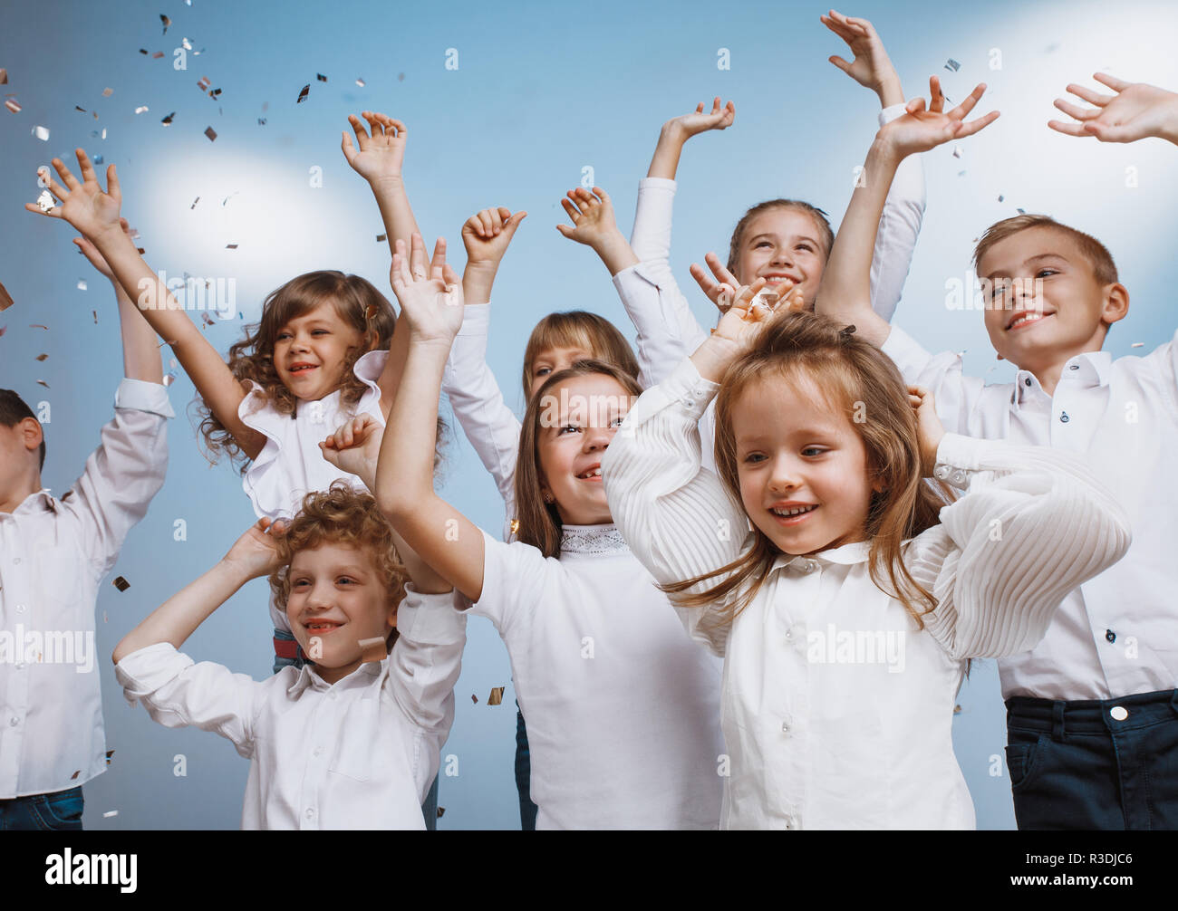 Adorable kids have fun together at birthday party. They playing ...