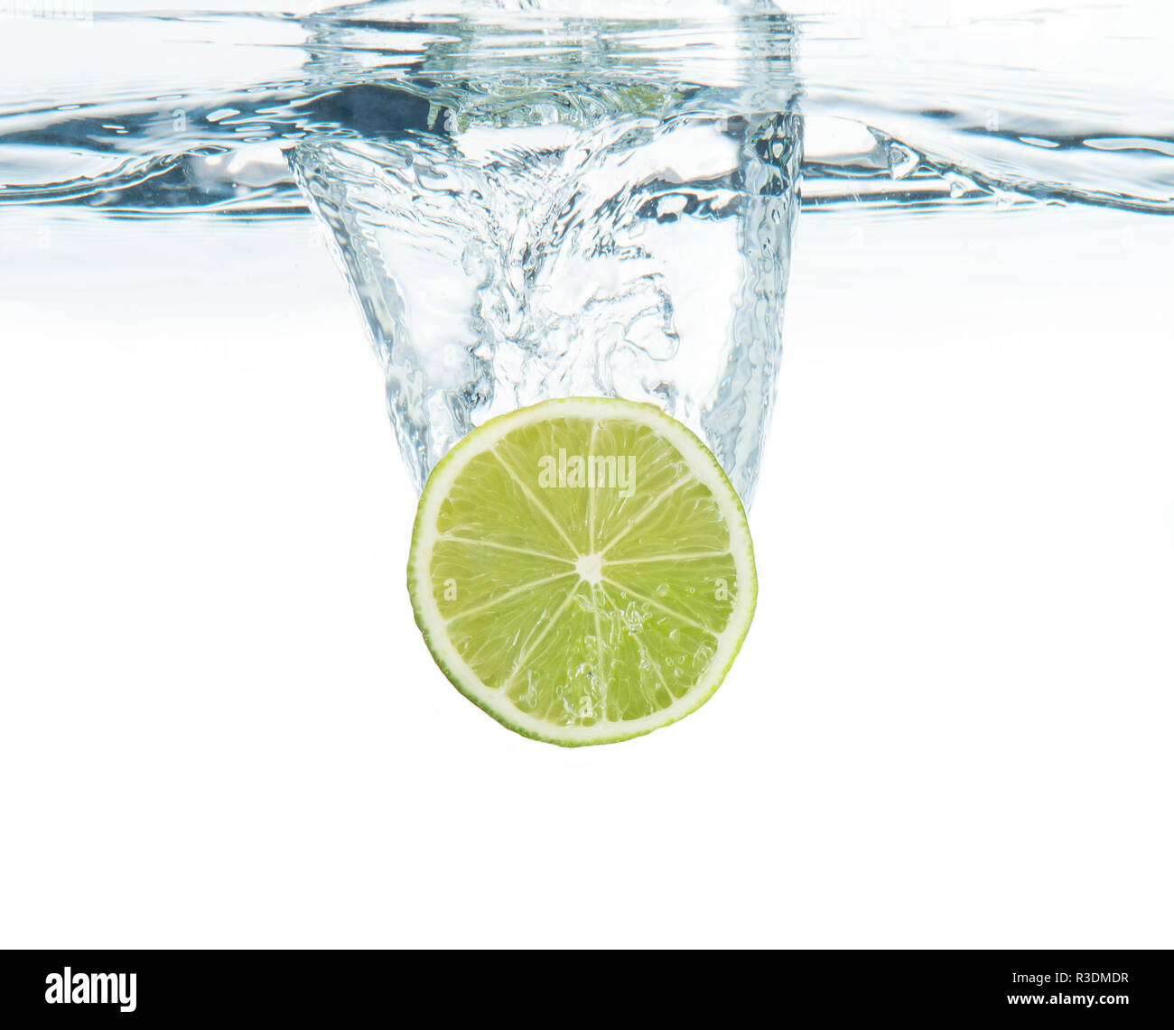 lime falling into water Stock Photo - Alamy