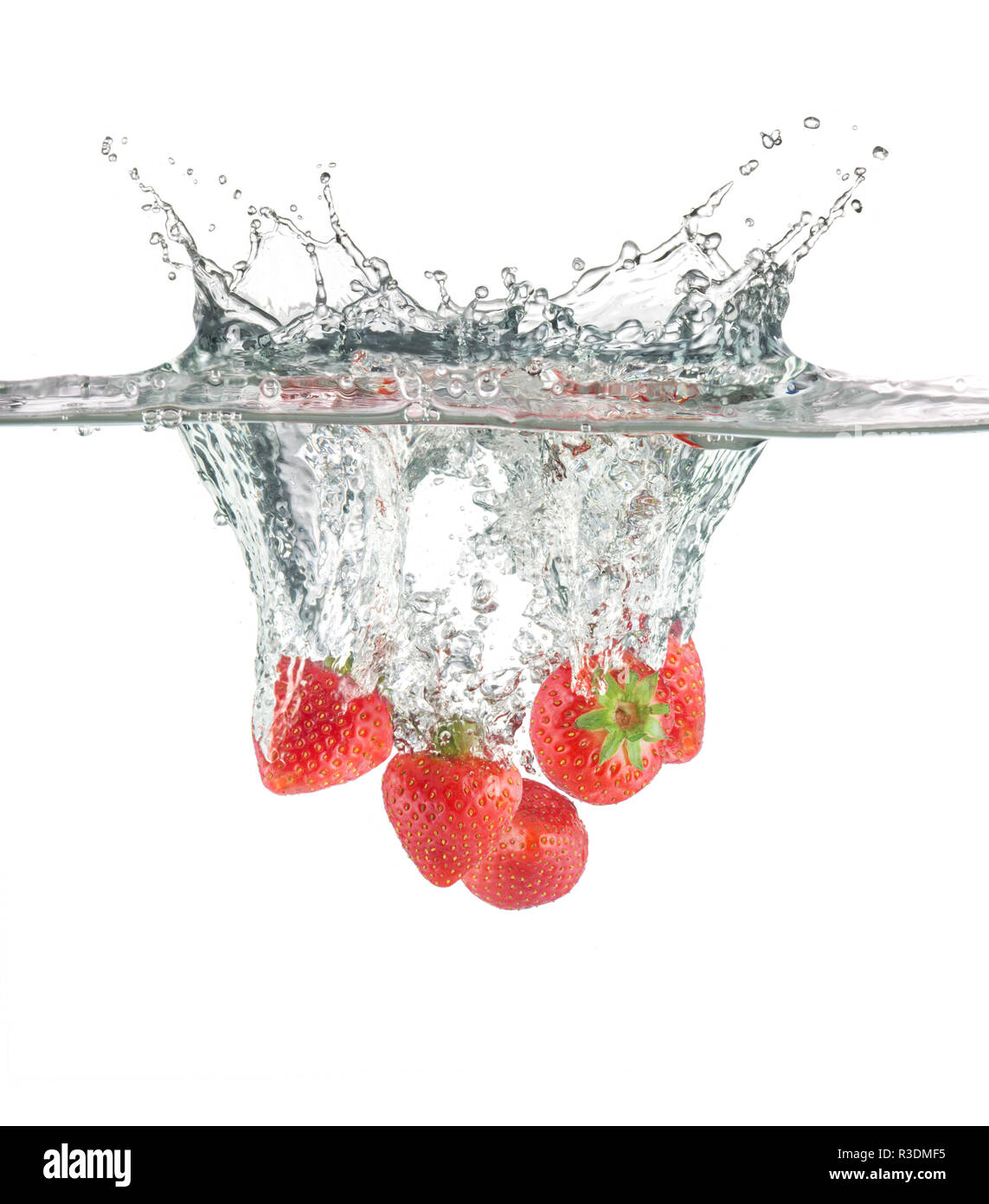 strawberries falling into water Stock Photo - Alamy