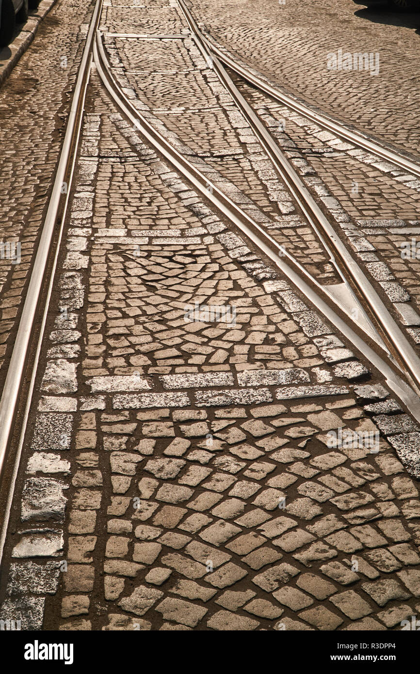 Crossroads tram tracks on a cobbled street in Poznan Stock Photo - Alamy