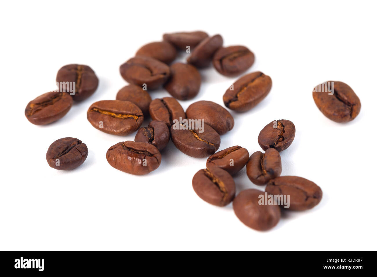 Roasted coffee beans isolated on white background. Three coffee beans ...