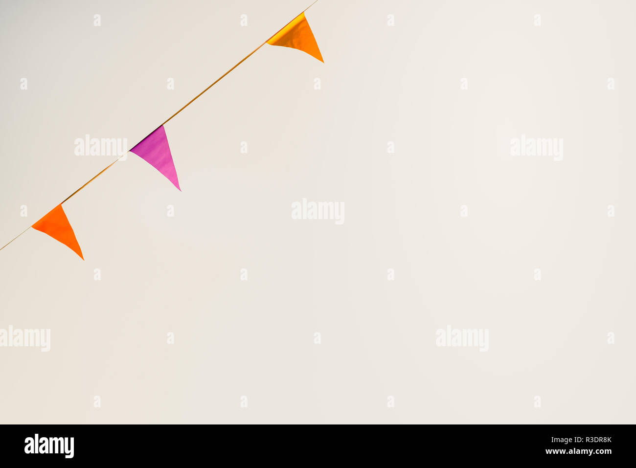 Colorful pennants with sky background to place text Stock Photo - Alamy