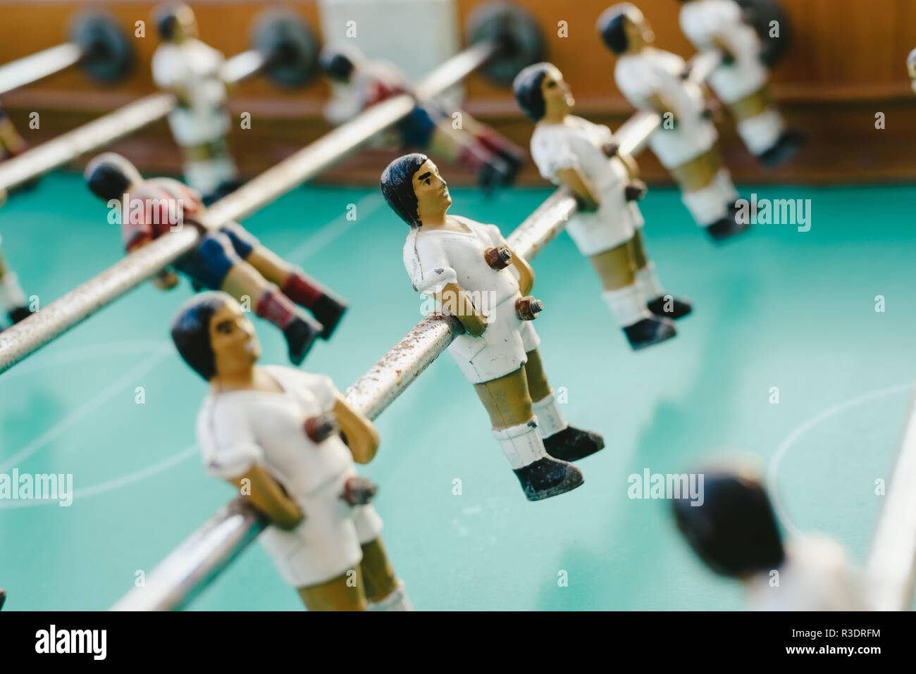 dolls of a retro foosball table to play table football Stock Photo - Alamy