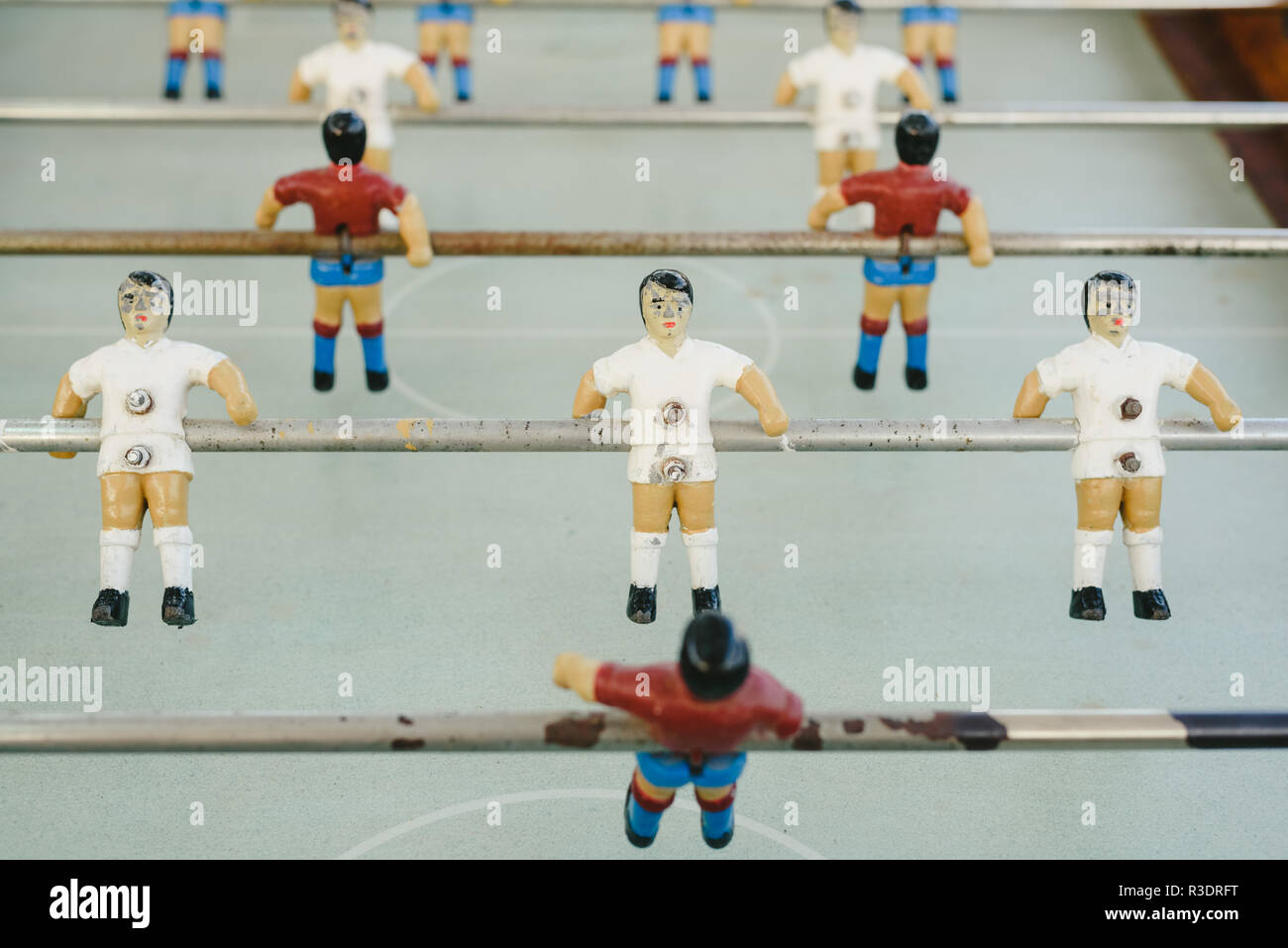 dolls of a retro foosball table to play table football Stock Photo - Alamy