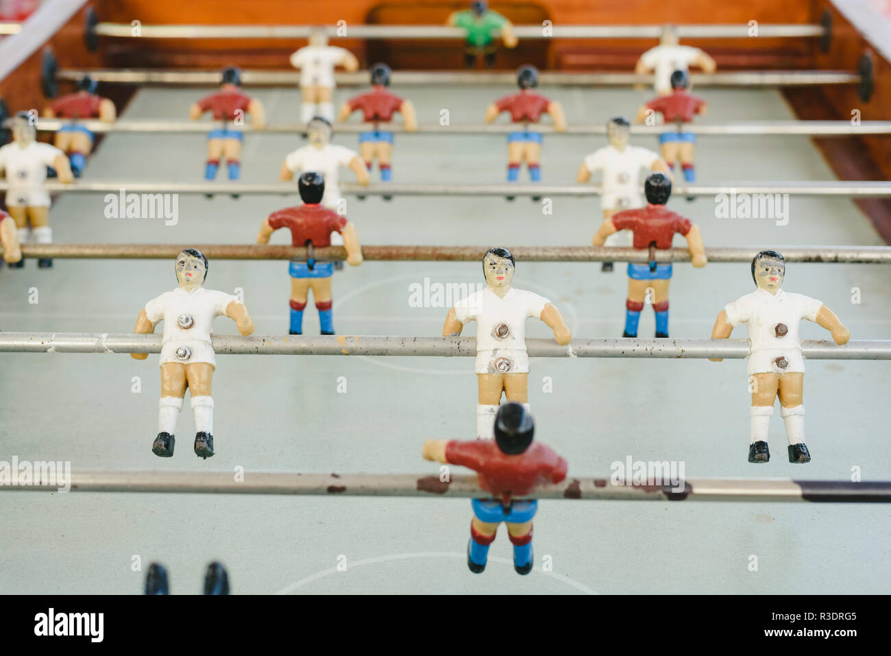 dolls of a retro foosball table to play table football Stock Photo - Alamy