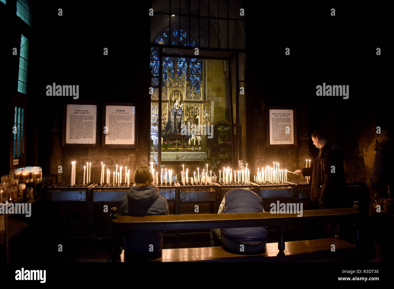 Lighting offertory candles hi-res stock photography and images - Alamy