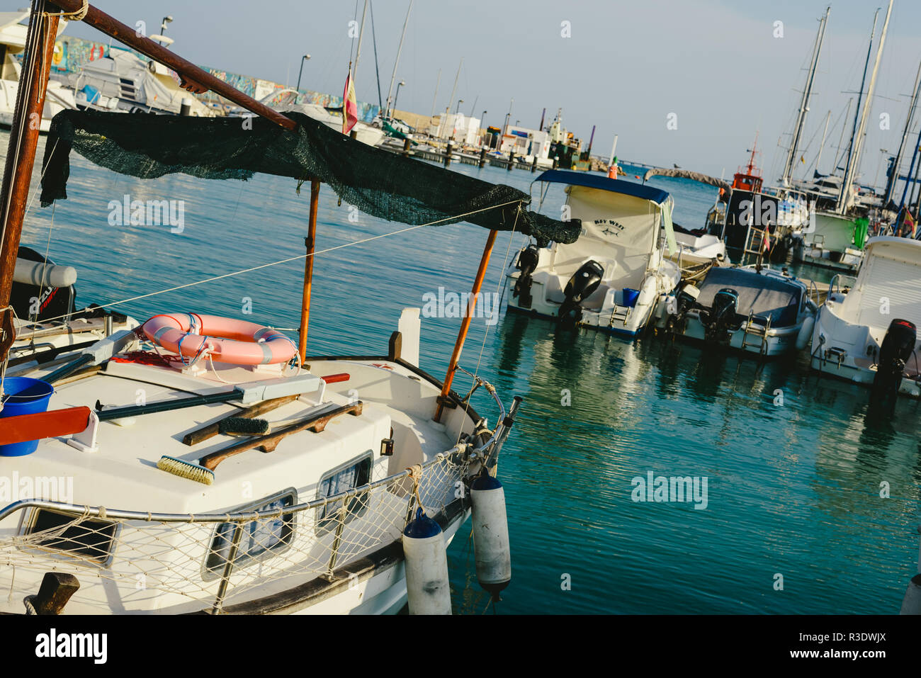 Boats moored at their jetty inside a marina Stock Photo - Alamy