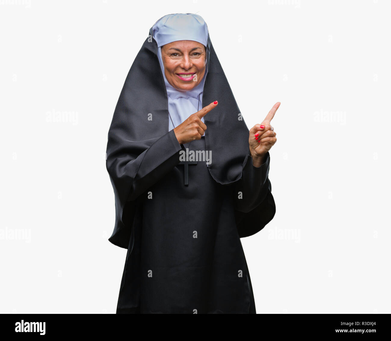 Middle age senior christian catholic nun woman over isolated background ...