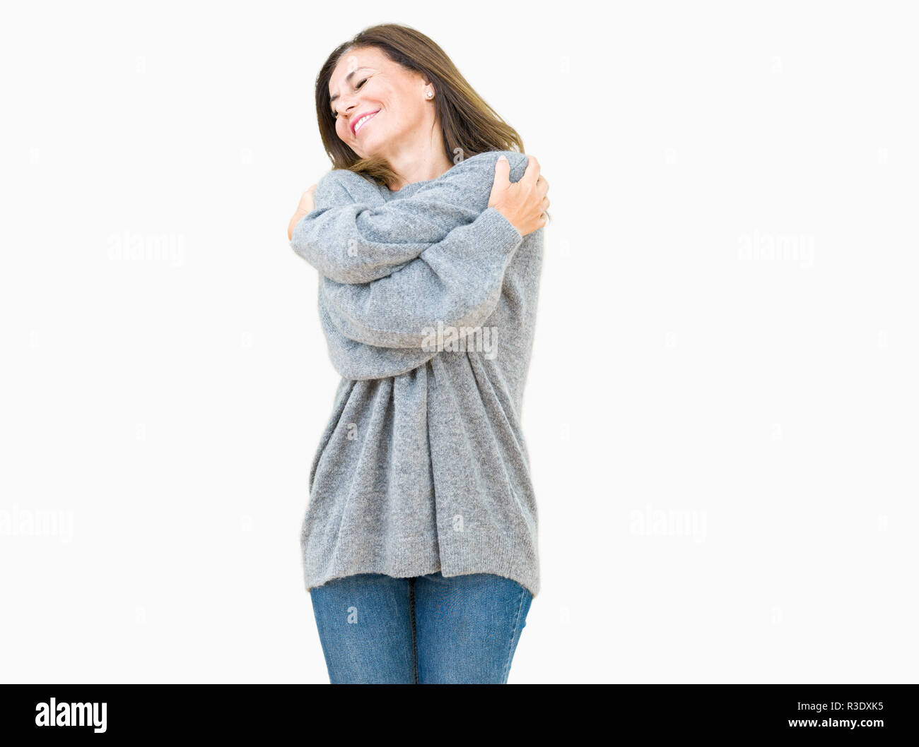 Beautiful middle age woman wearing winter sweater over isolated ...