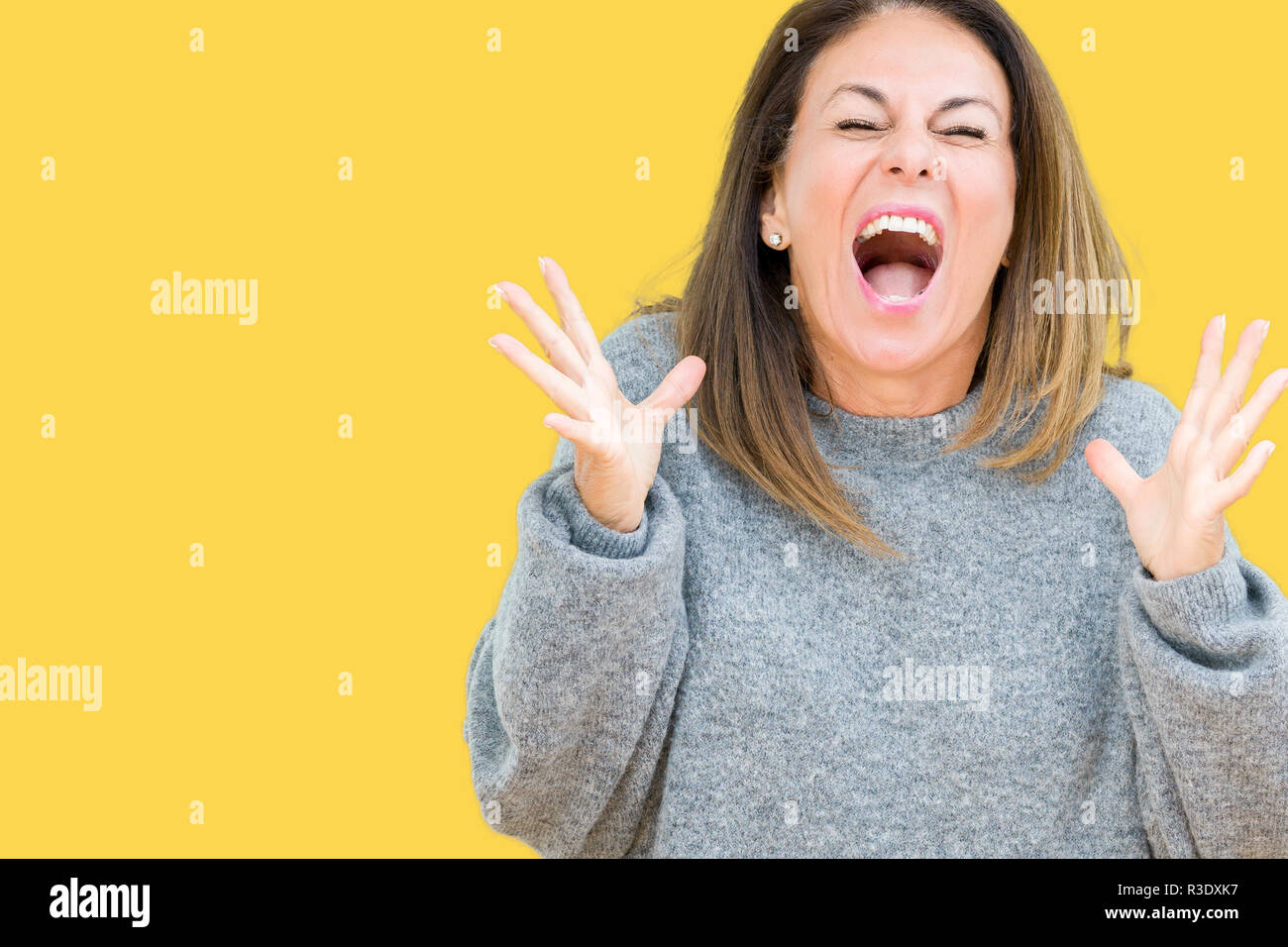 Beautiful middle age woman wearing winter sweater over isolated ...