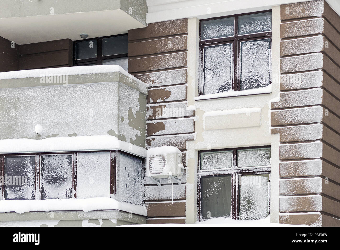 Wall with windows of modern high-rise apartment building covered with ...