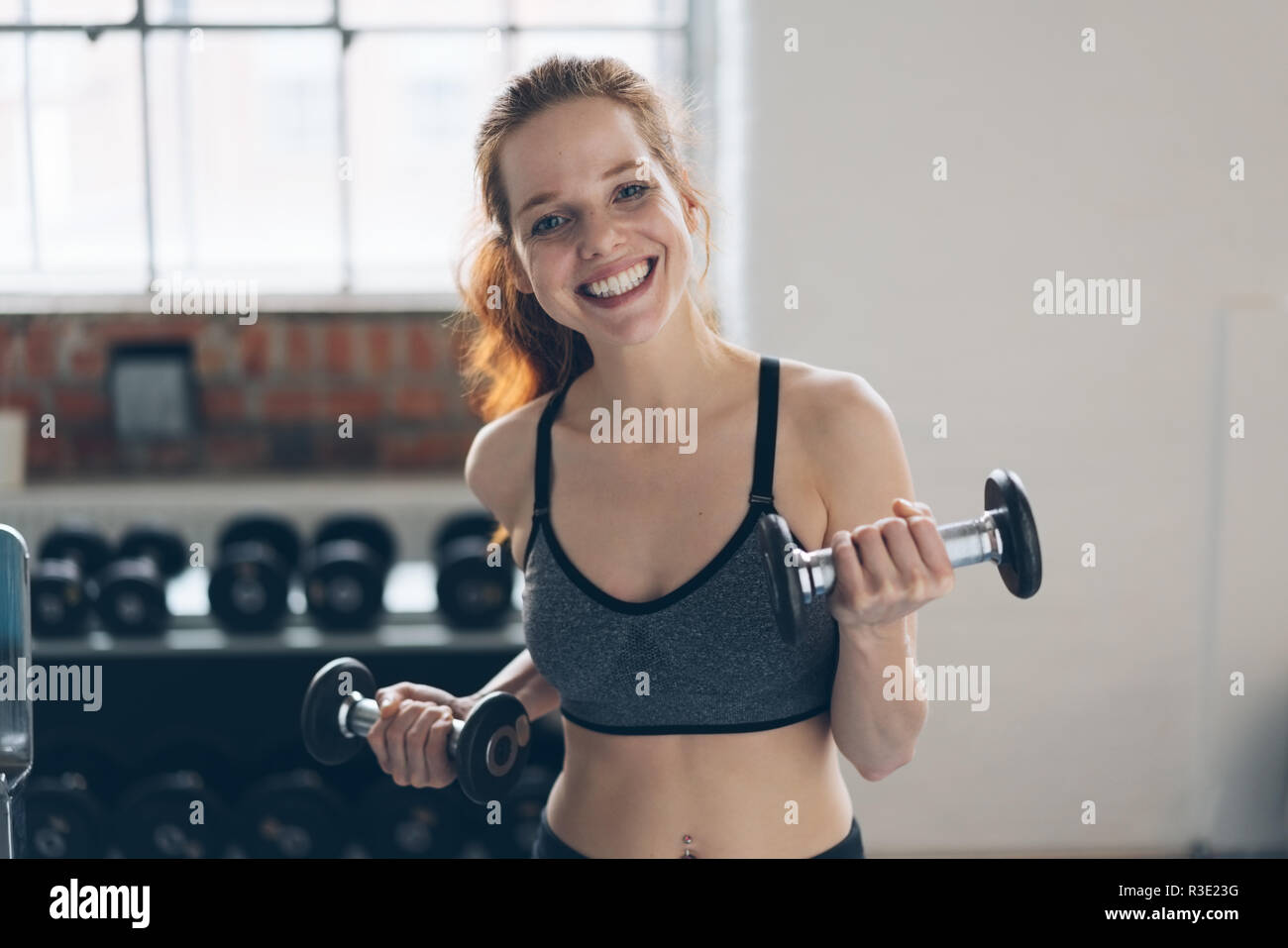 Happy person lifting dumbells hi-res stock photography and images - Alamy