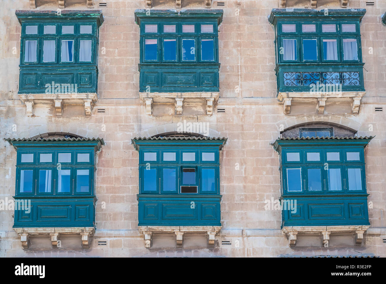Six old green Maltese wooden balconies facade in valletta Malta. one of ...