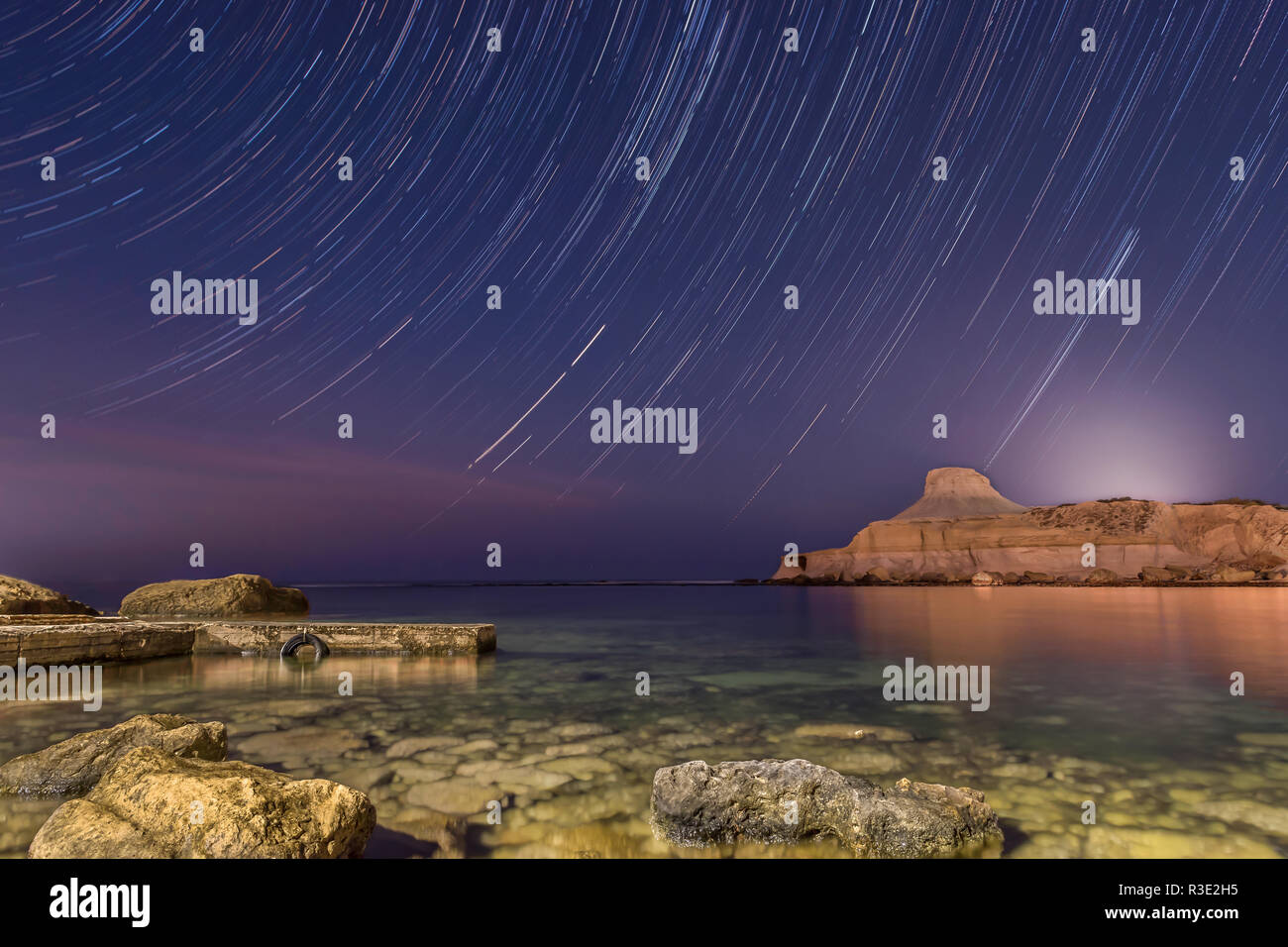 Night sky star trail over the bay of Xwejni Gozo. Malta. Horizontal ...