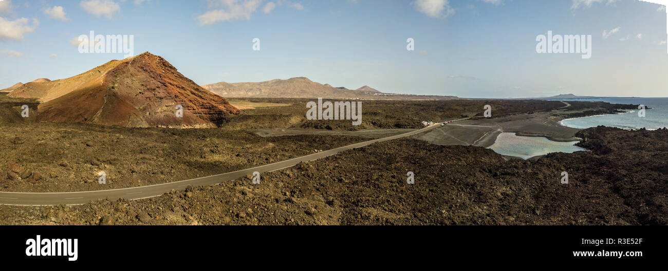 Aerial view of the Bermeja mountain of an intense red color, surrounded ...